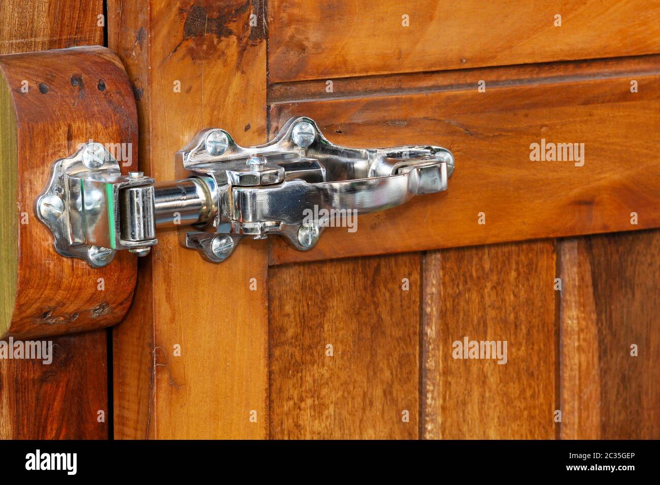 Old metal lock at brown wood door Stock Photo - Alamy