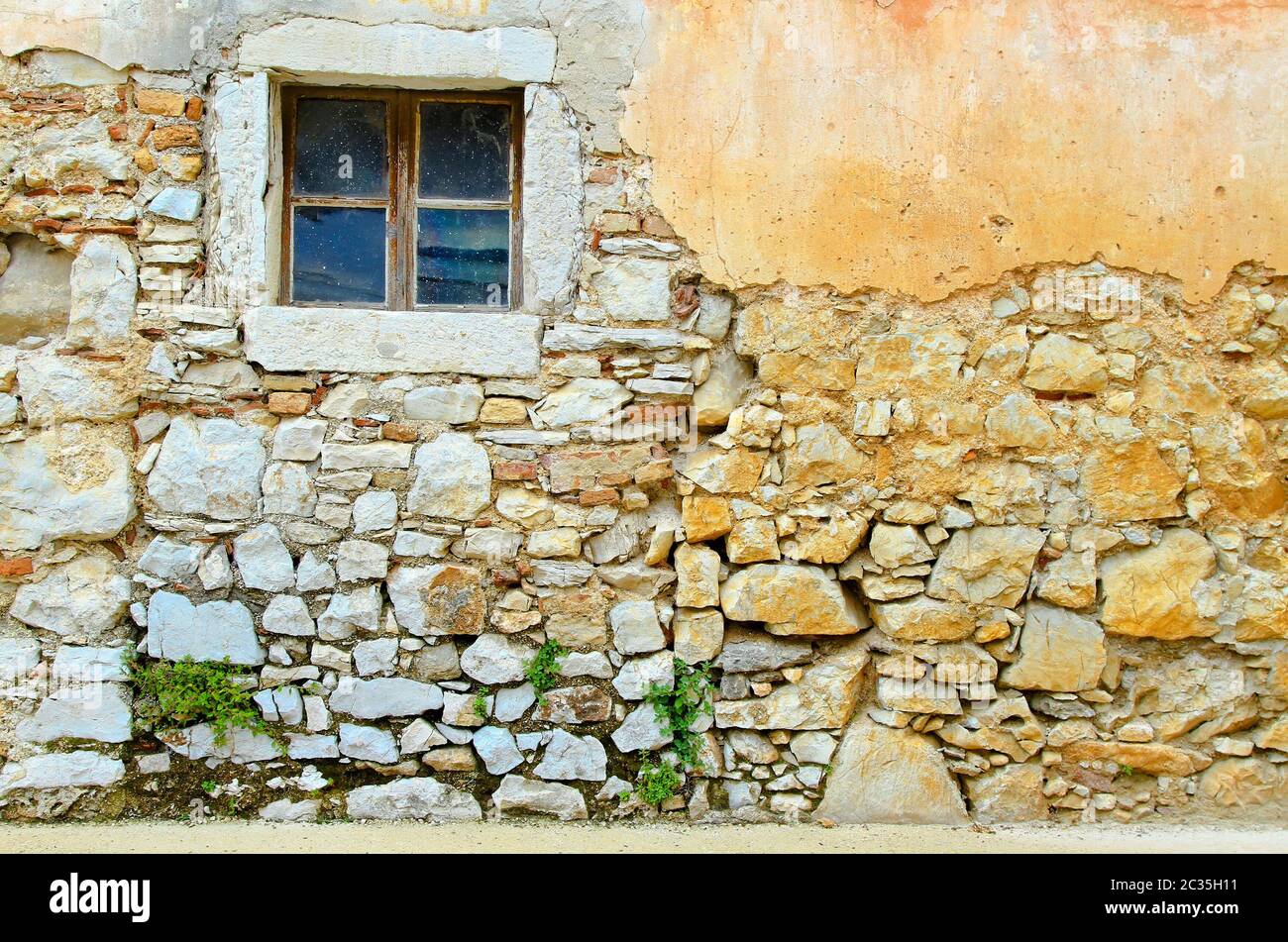Window and stone wall at derelict house Stock Photo - Alamy