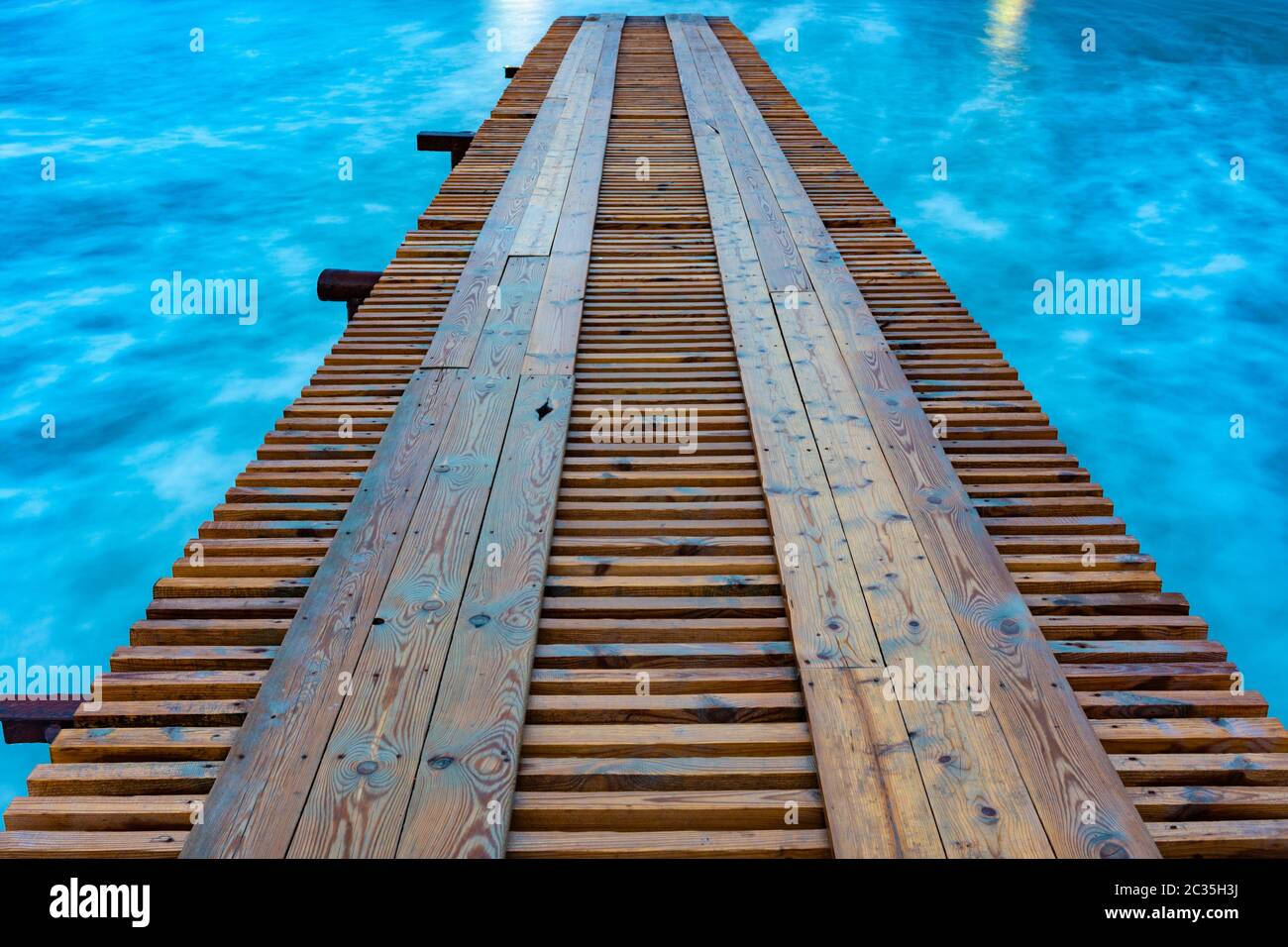 Long distance bridge by the sea, long exposure Stock Photo - Alamy