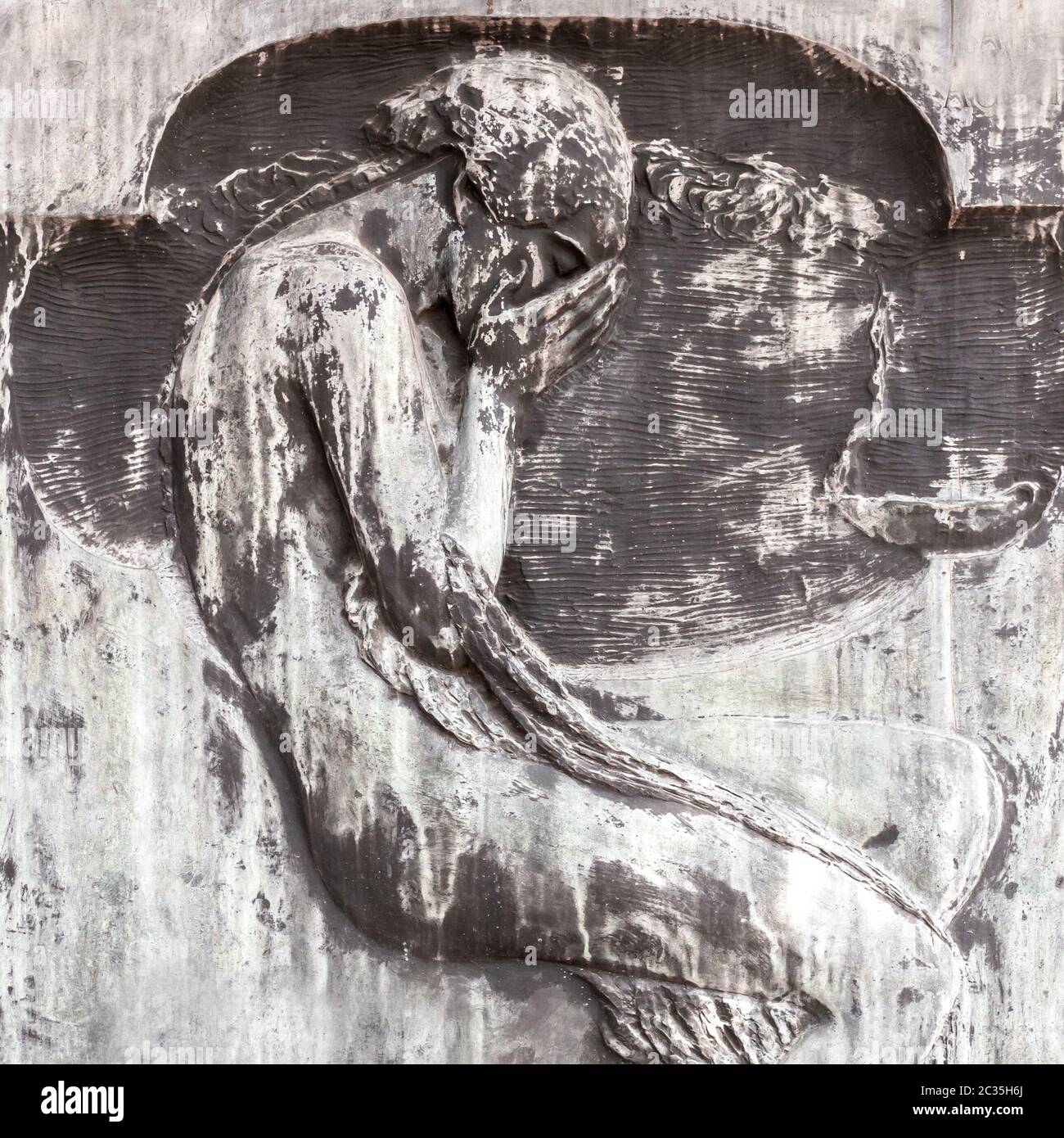 Carved of weeping man Stock Photo - Alamy