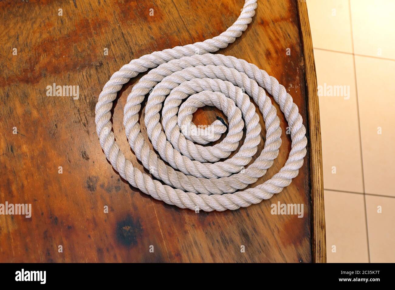 Rope in Coil at Wooden Boat Deck Stock Photo - Alamy