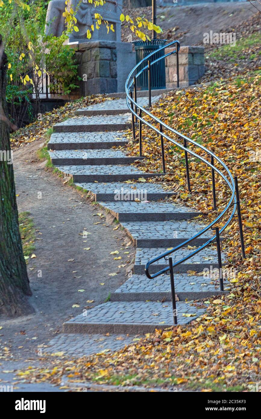 Curved Stairway With Fallen Leaves at Autumn Stock Photo - Alamy
