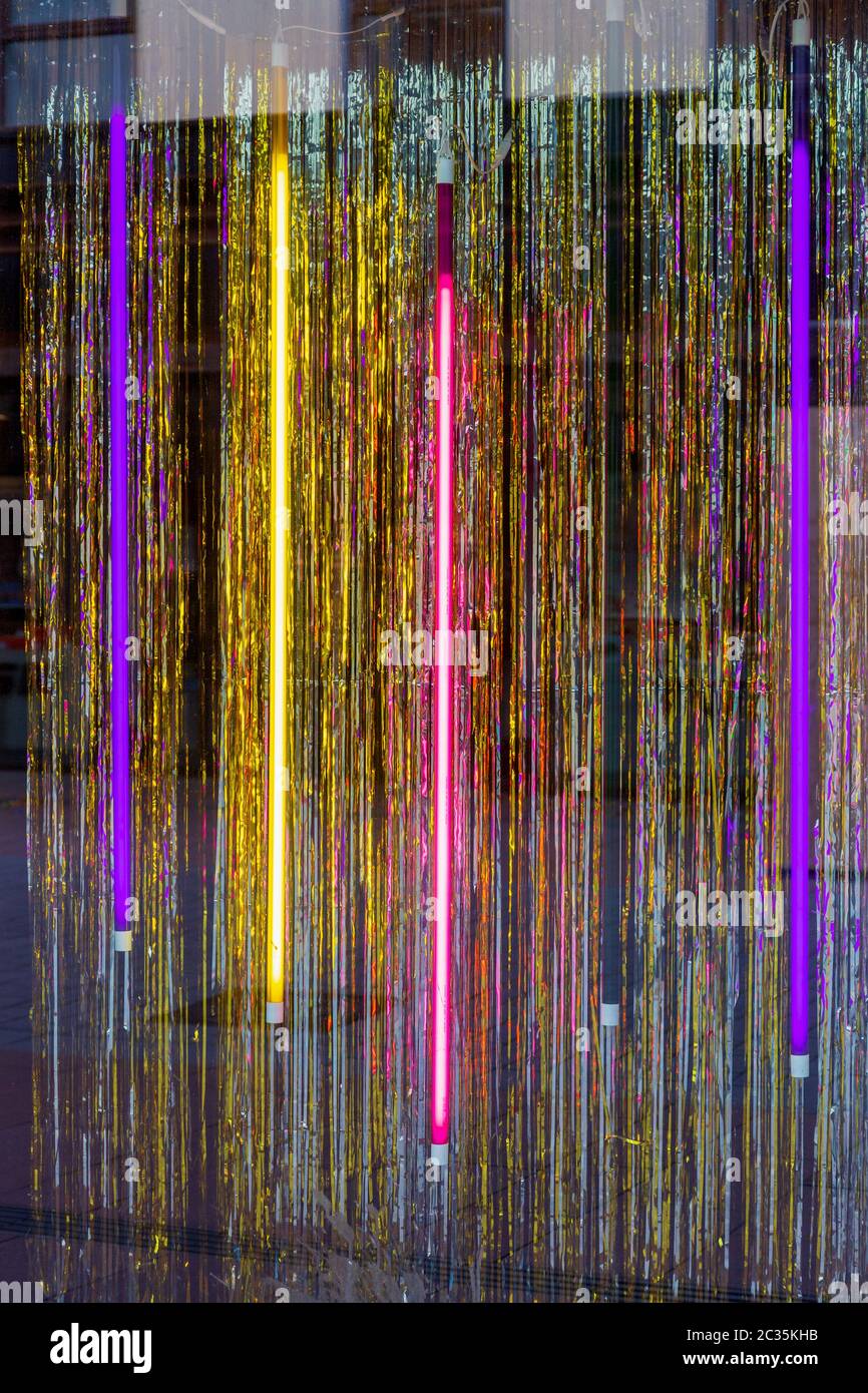 Colourful Retro Neons Light Sticks in Window Stock Photo - Alamy