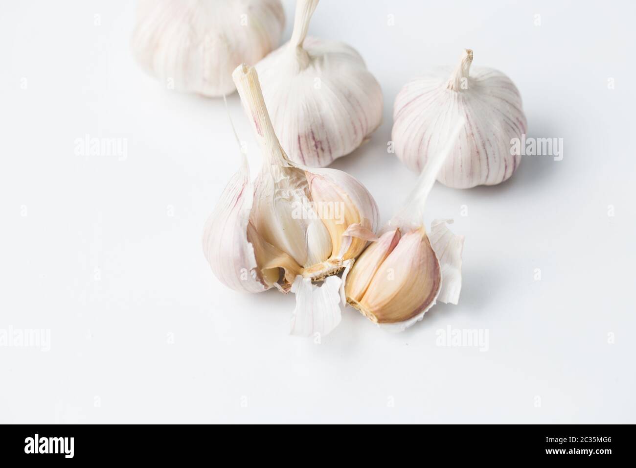 Fresh garlic bulb-garlic clover on the white background Stock Photo - Alamy