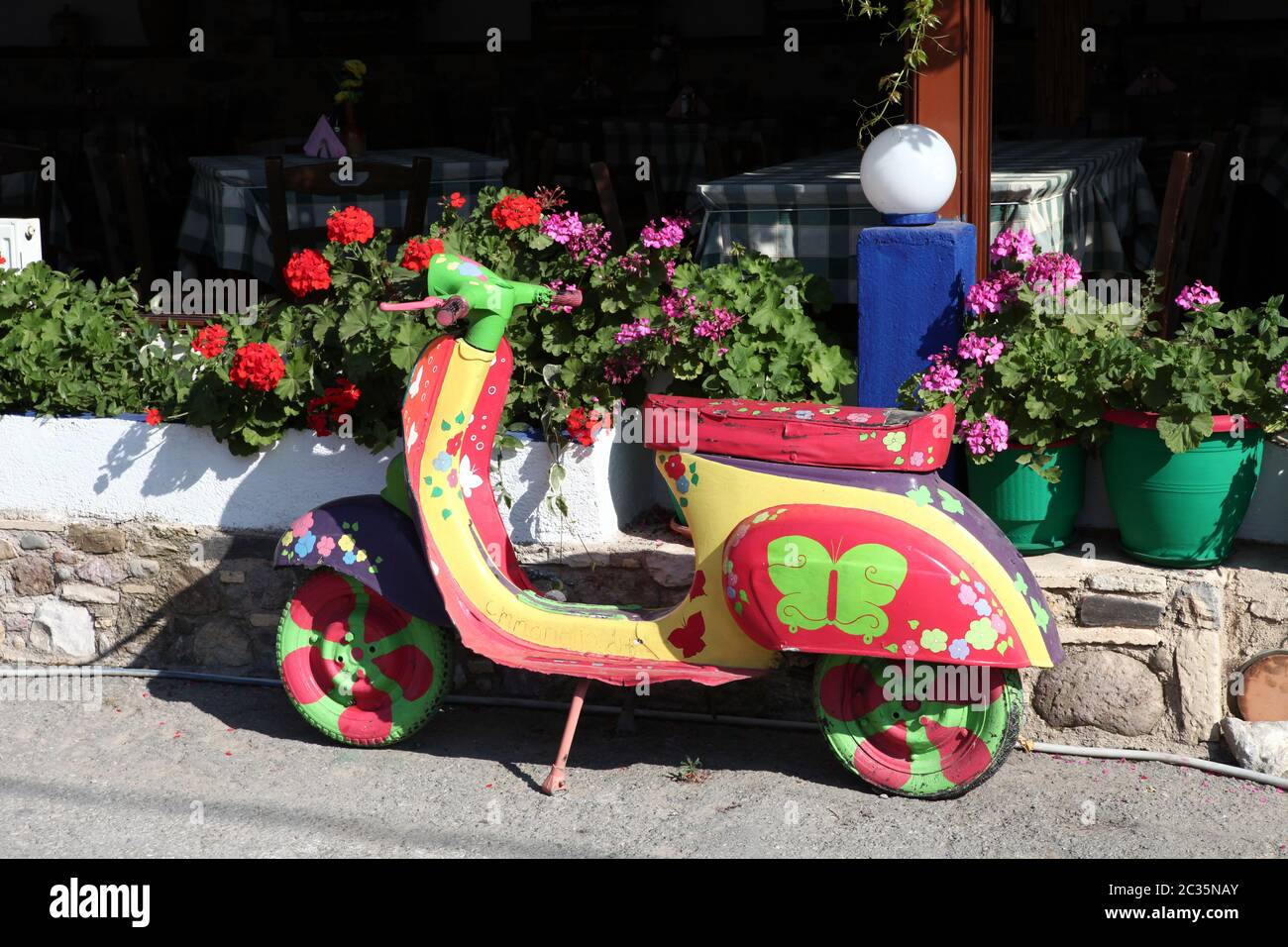 Rejuvenated colors and flowers scooter Stock Photo - Alamy