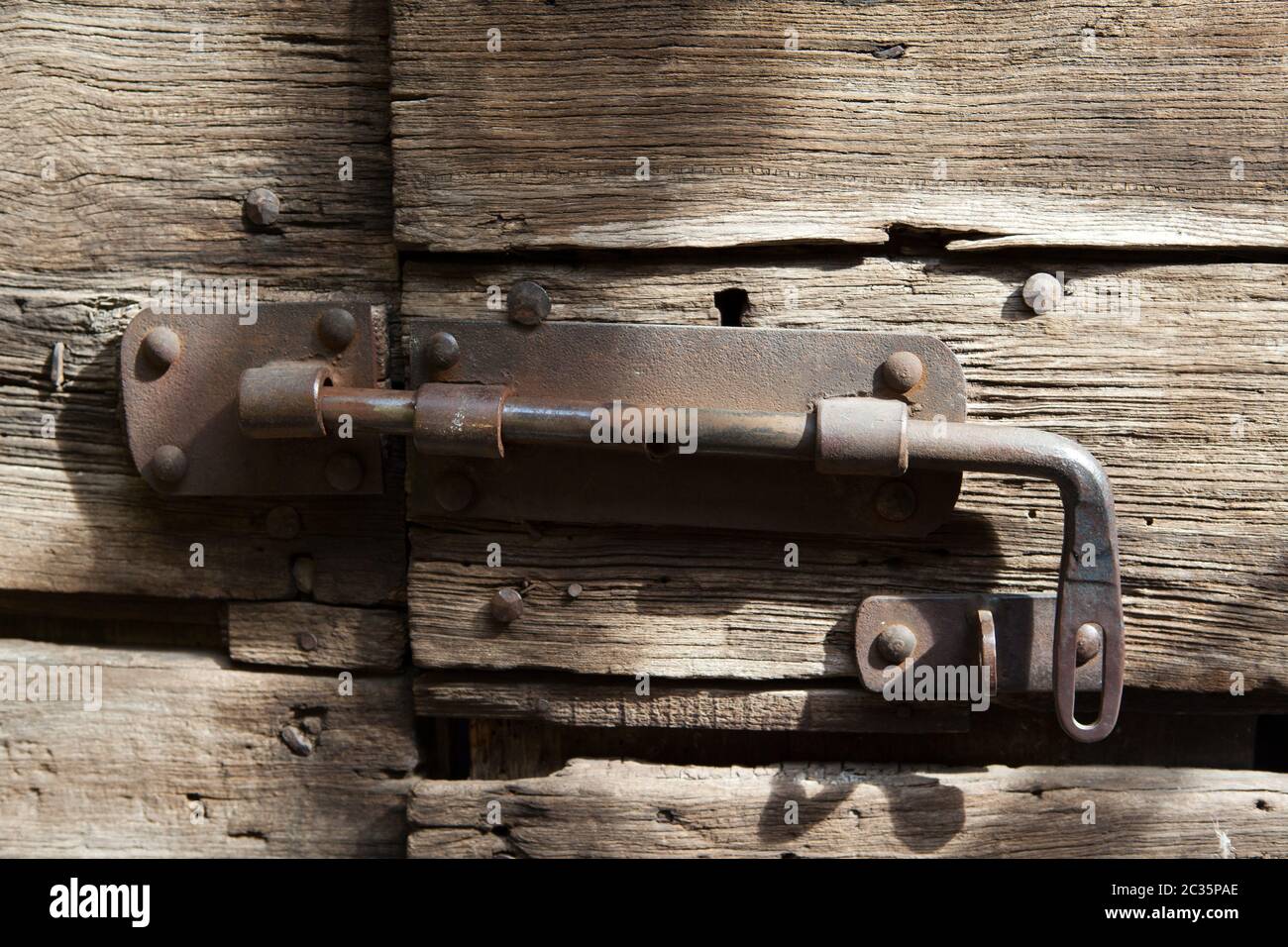 Old door lock on a wood door Stock Photo - Alamy