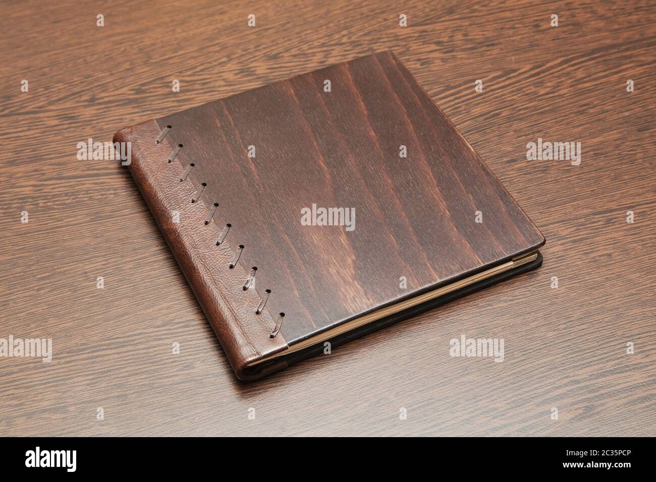 Note book with hard wooden cover Stock Photo - Alamy
