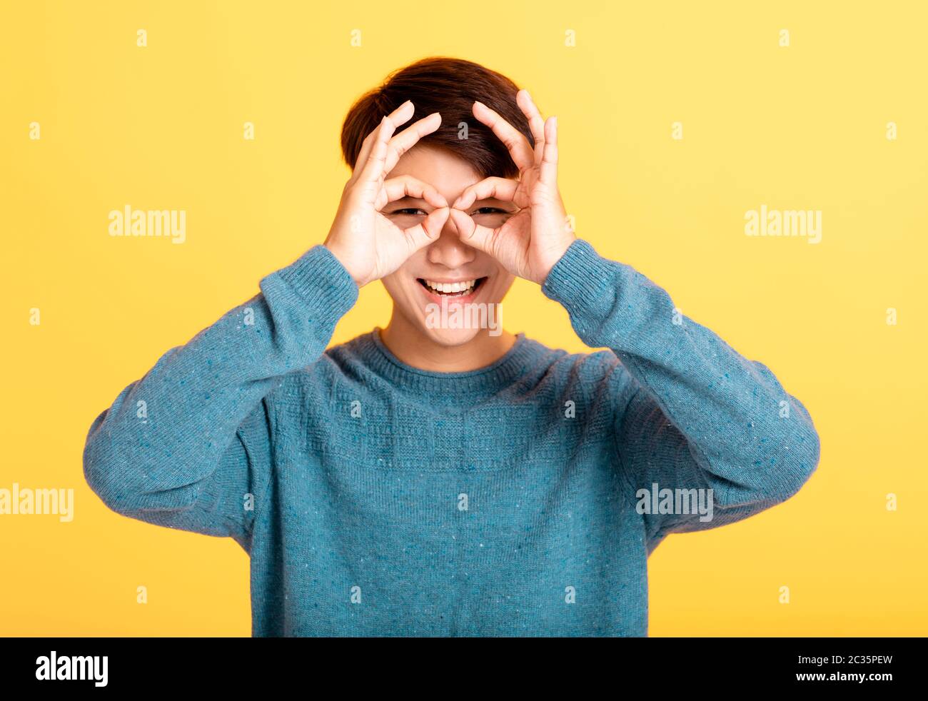 Portrait of handsome young man with looking gesture Stock Photo - Alamy