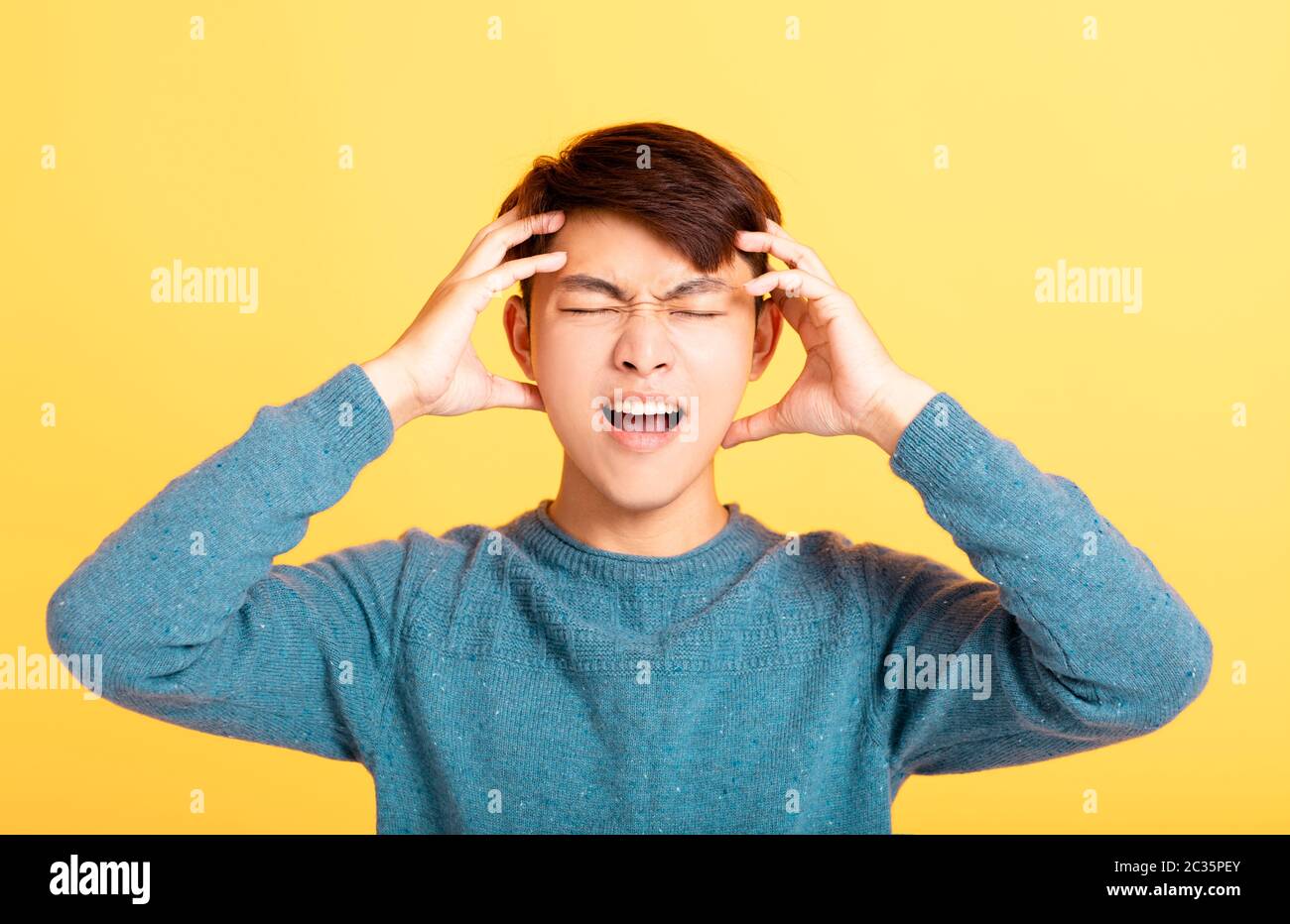 Troubled man hands on head hi-res stock photography and images - Alamy
