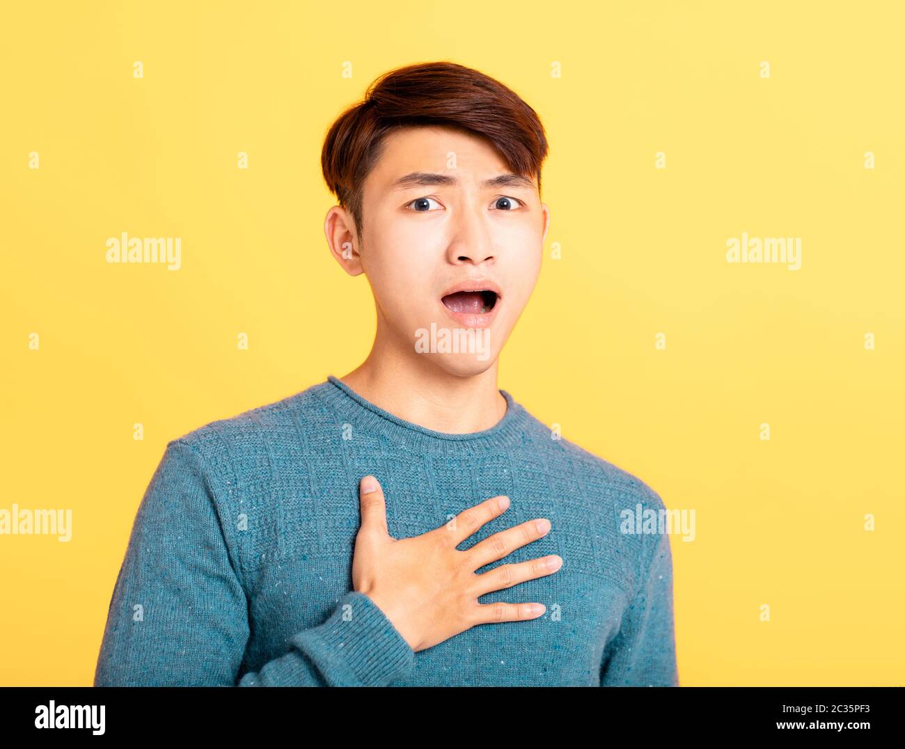 portrait of surprised asian young man Stock Photo - Alamy