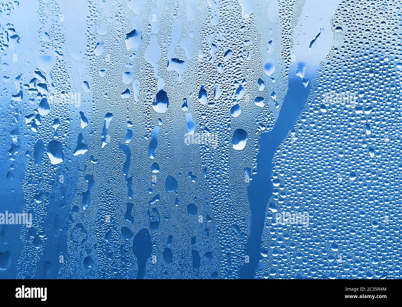 large and fine water drops on blue glass Stock Photo - Alamy