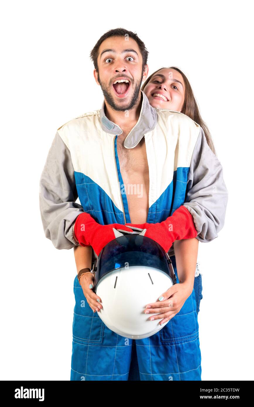 Racing driver posing with girl isolated in white Stock Photo - Alamy