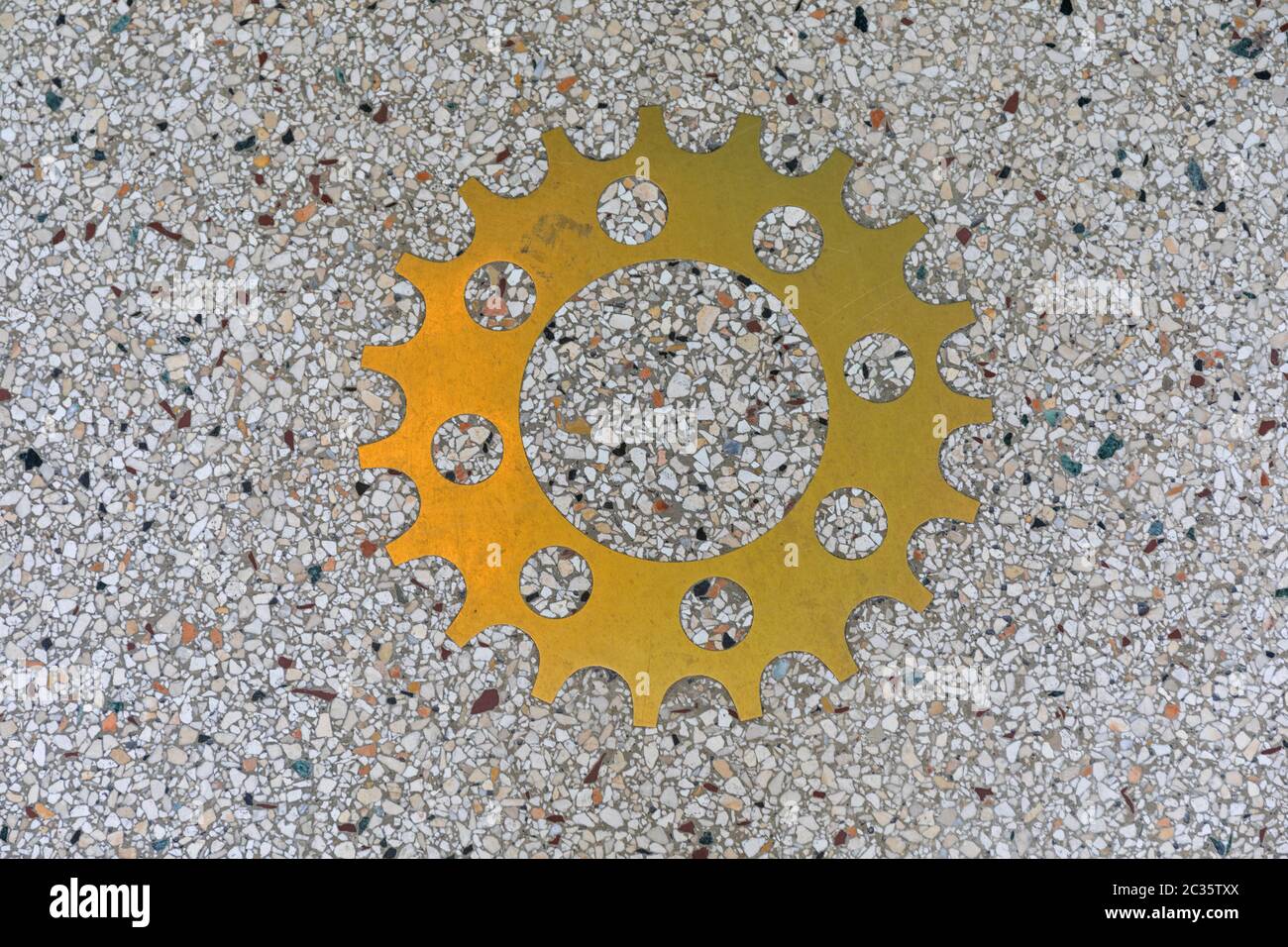 One Brass Cog Gear Part at Floor Stock Photo - Alamy