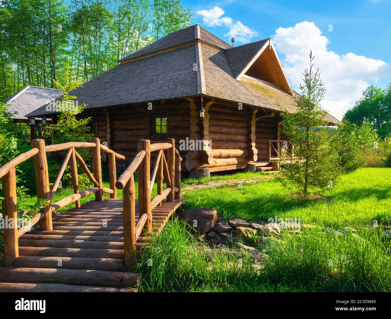 Wooden house in forest Stock Photo - Alamy