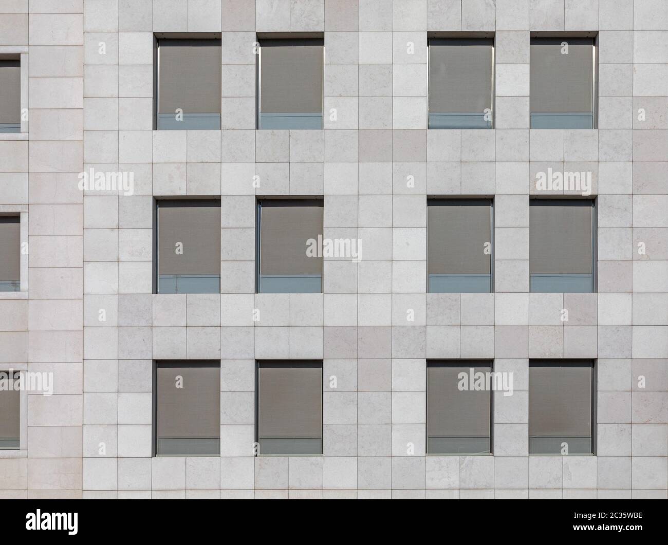 Gray Windows at Modern Marble Building Facade Stock Photo - Alamy