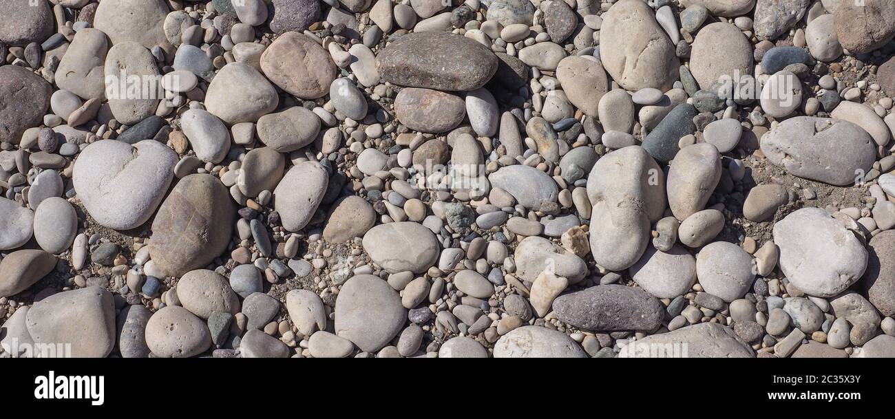 wide grey cobble texture useful as a background Stock Photo - Alamy