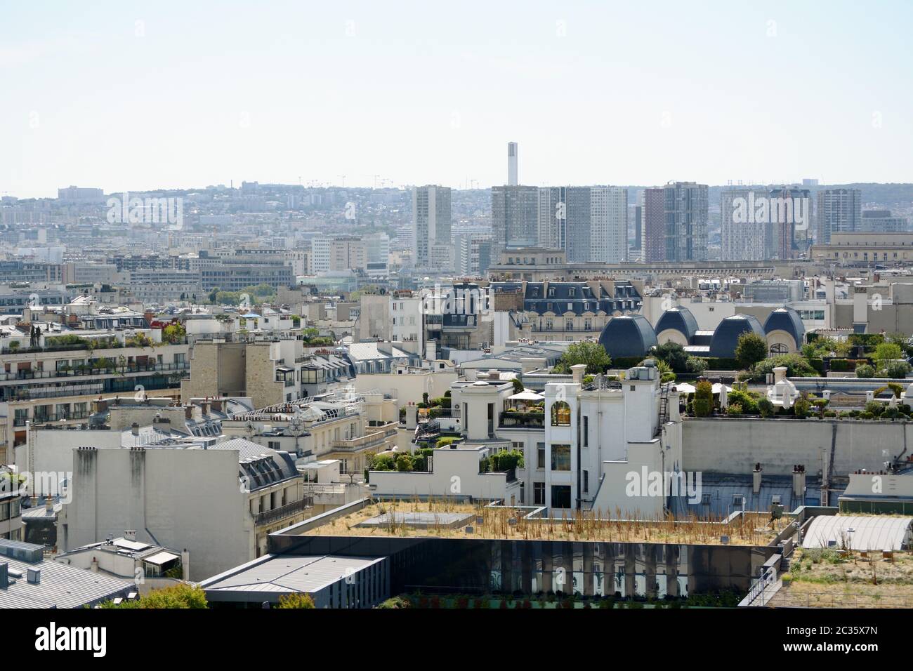 Paris cityscape with roof gardens with high-rise buildings and ...
