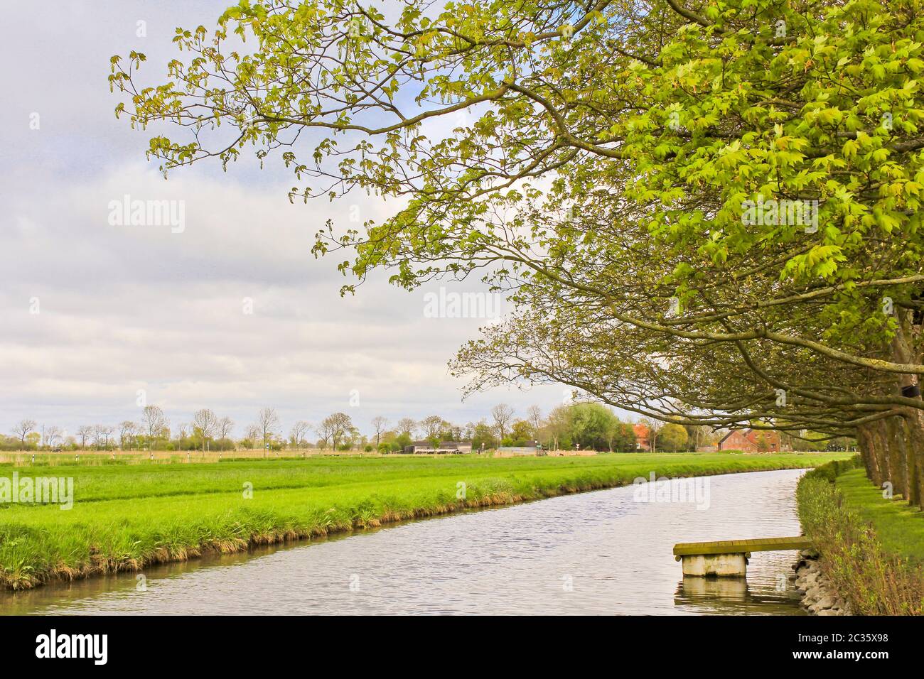 Landscape in northern Germany with a river and green meadows. Sehestedt ...