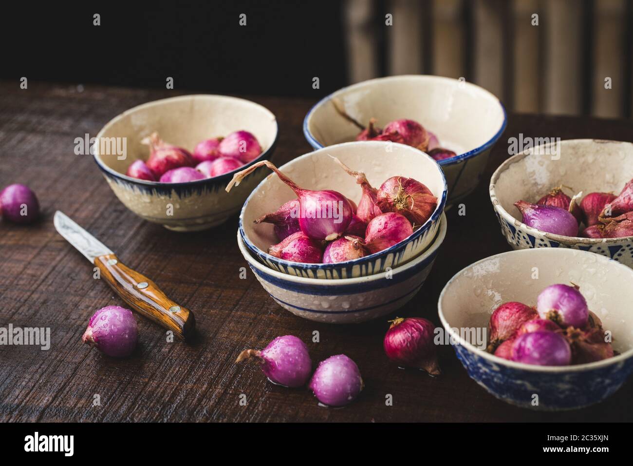 Fresh shallot- Red onion on the dark background Stock Photo - Alamy