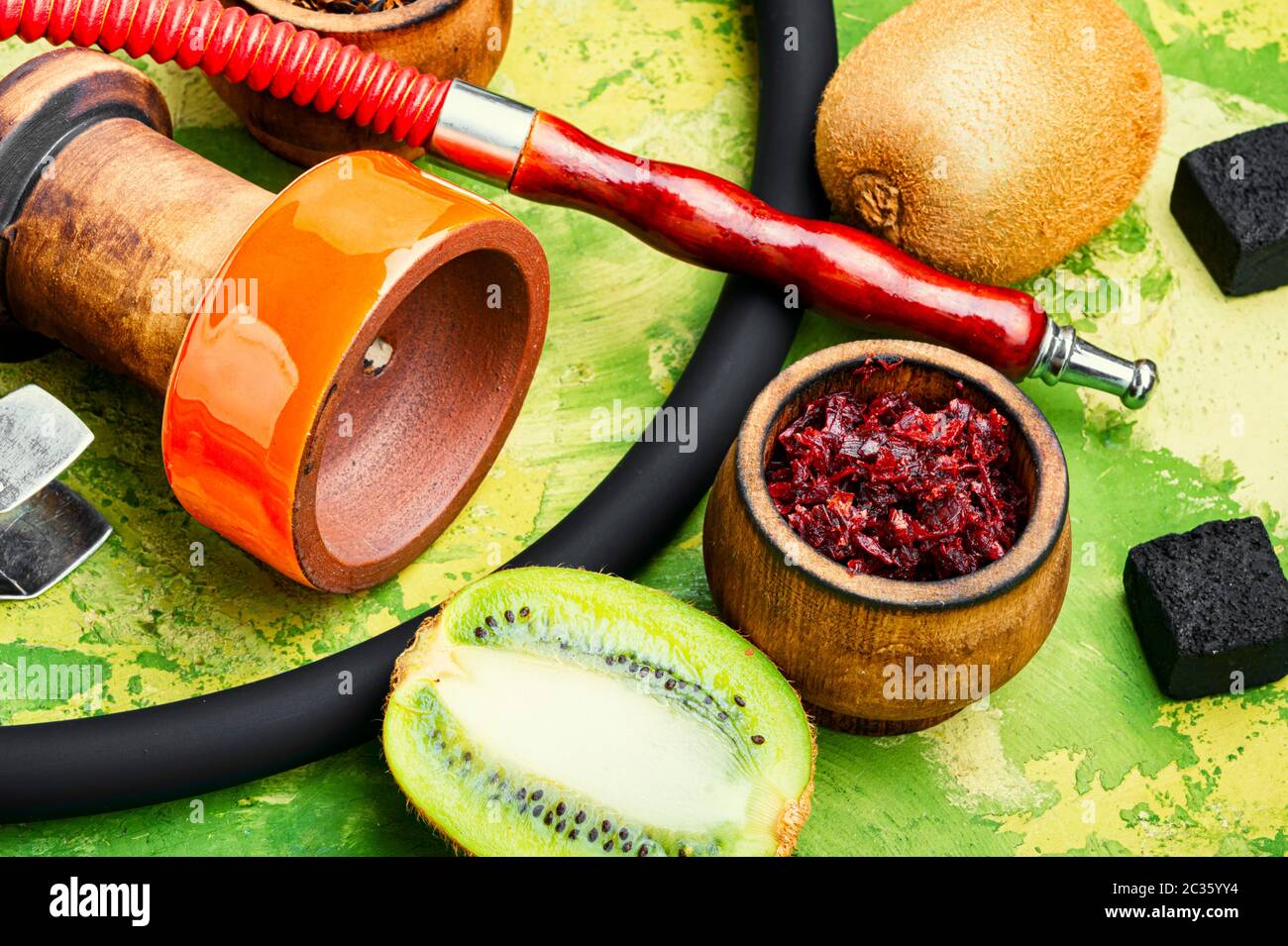 Arabic smoking hookah with taste of kiwi.Fruit shisha tobacco. Tobacco ...