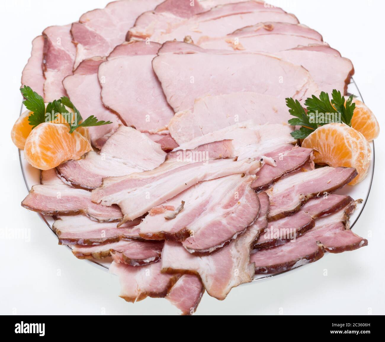 Plate of smoked meat isolated on white background Stock Photo - Alamy