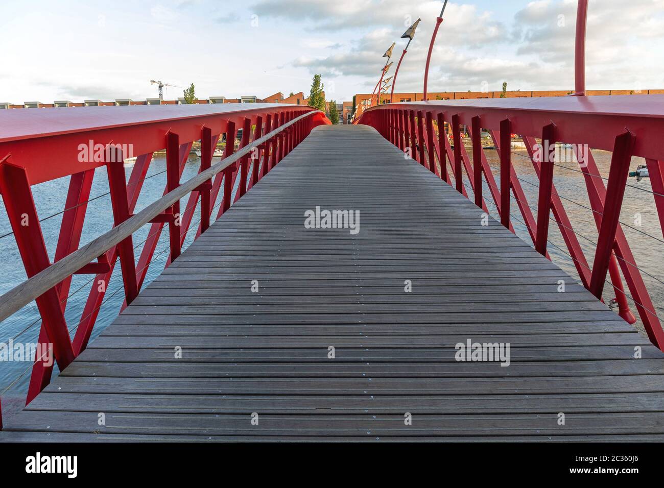 Red Python Bridge at Eastern Docklands in Amsterdam Stock Photo - Alamy