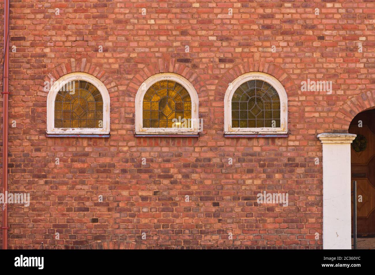 Three Arch Windows at Brick Wall Building Stock Photo - Alamy