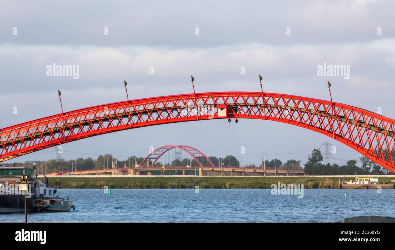 Red Python Bridge Arch in Amsterdam Netherlands Stock Photo - Alamy