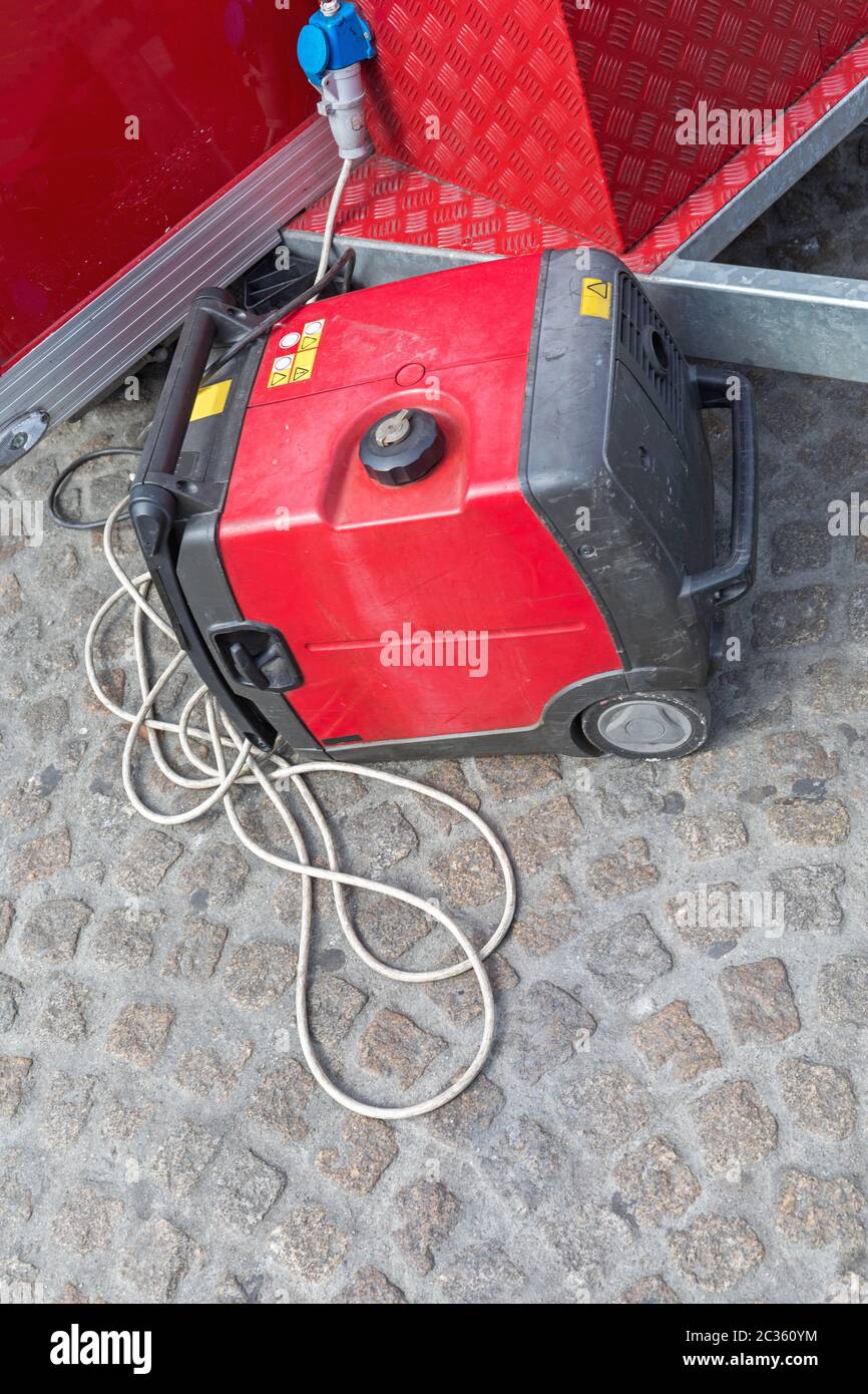 Portable Red Electric Power Generator at Street Stock Photo - Alamy