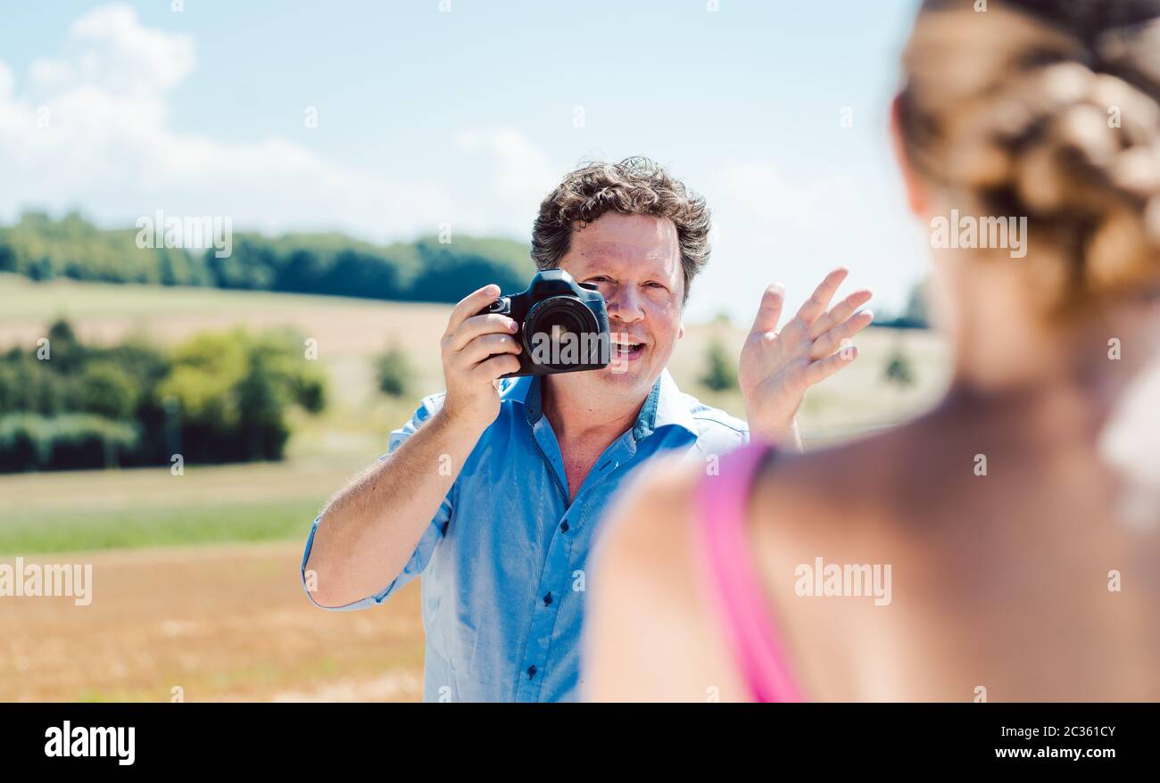 Photographer and model during a photo shoot working as a team Stock ...