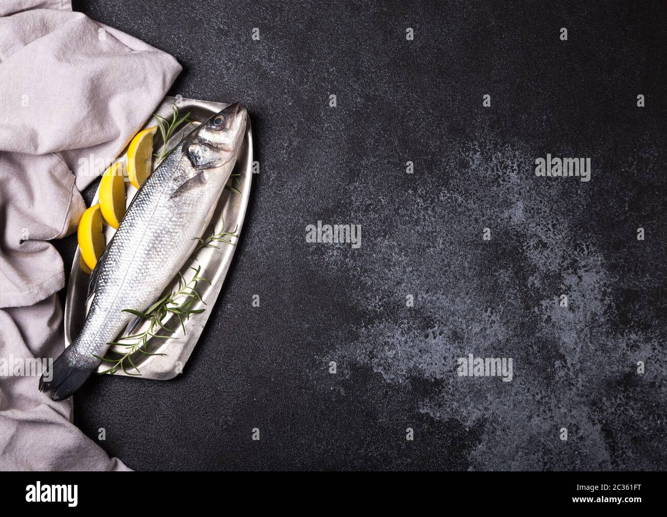 fresh raw whole sea bass. Raw seabass fish with spices and herbs ...