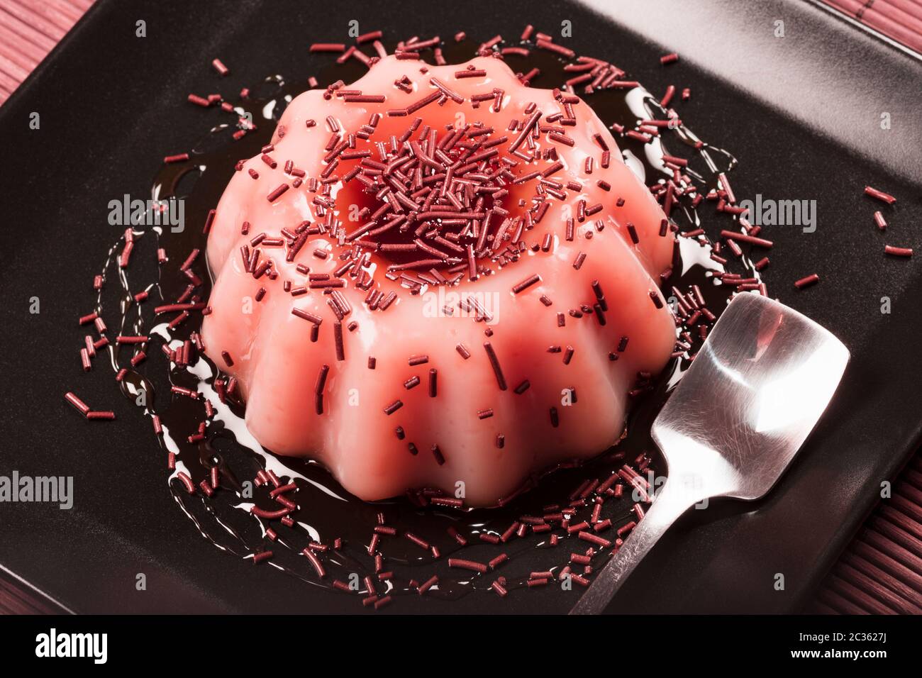 Red pudding as bundt cake is sweet dessert Stock Photo - Alamy