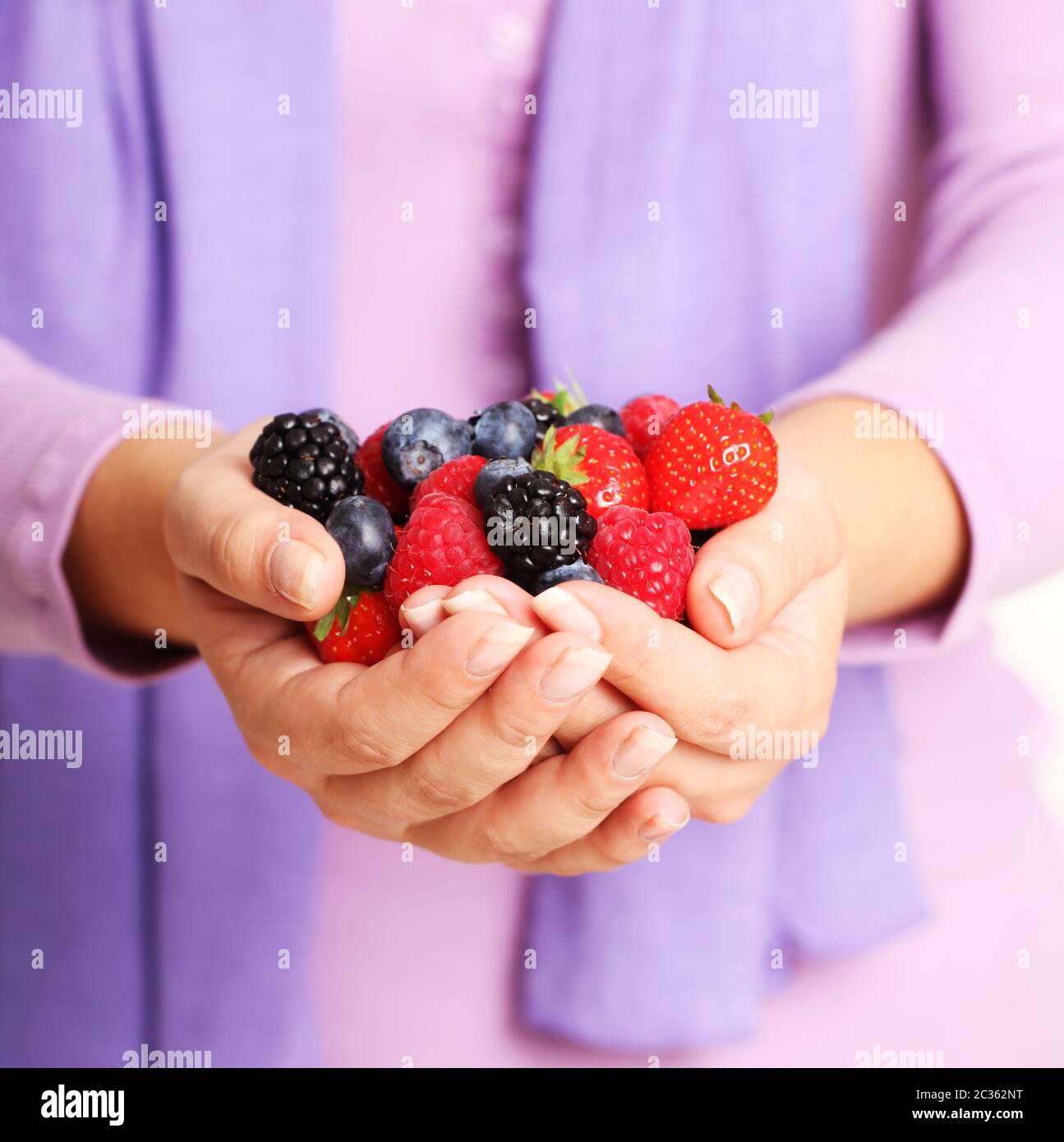 Female Hands Holding Mixed Berries Stock Photo - Alamy