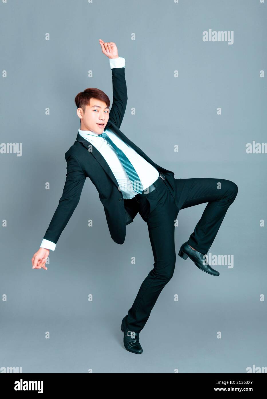 Young man motion happy suit hi-res stock photography and images - Alamy