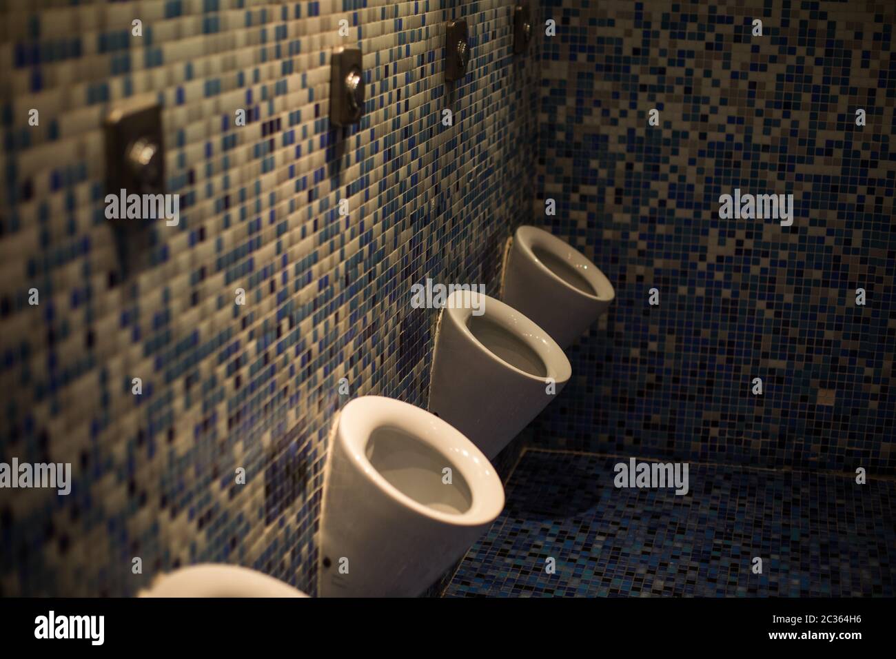Color image of a men's public toilet Stock Photo - Alamy