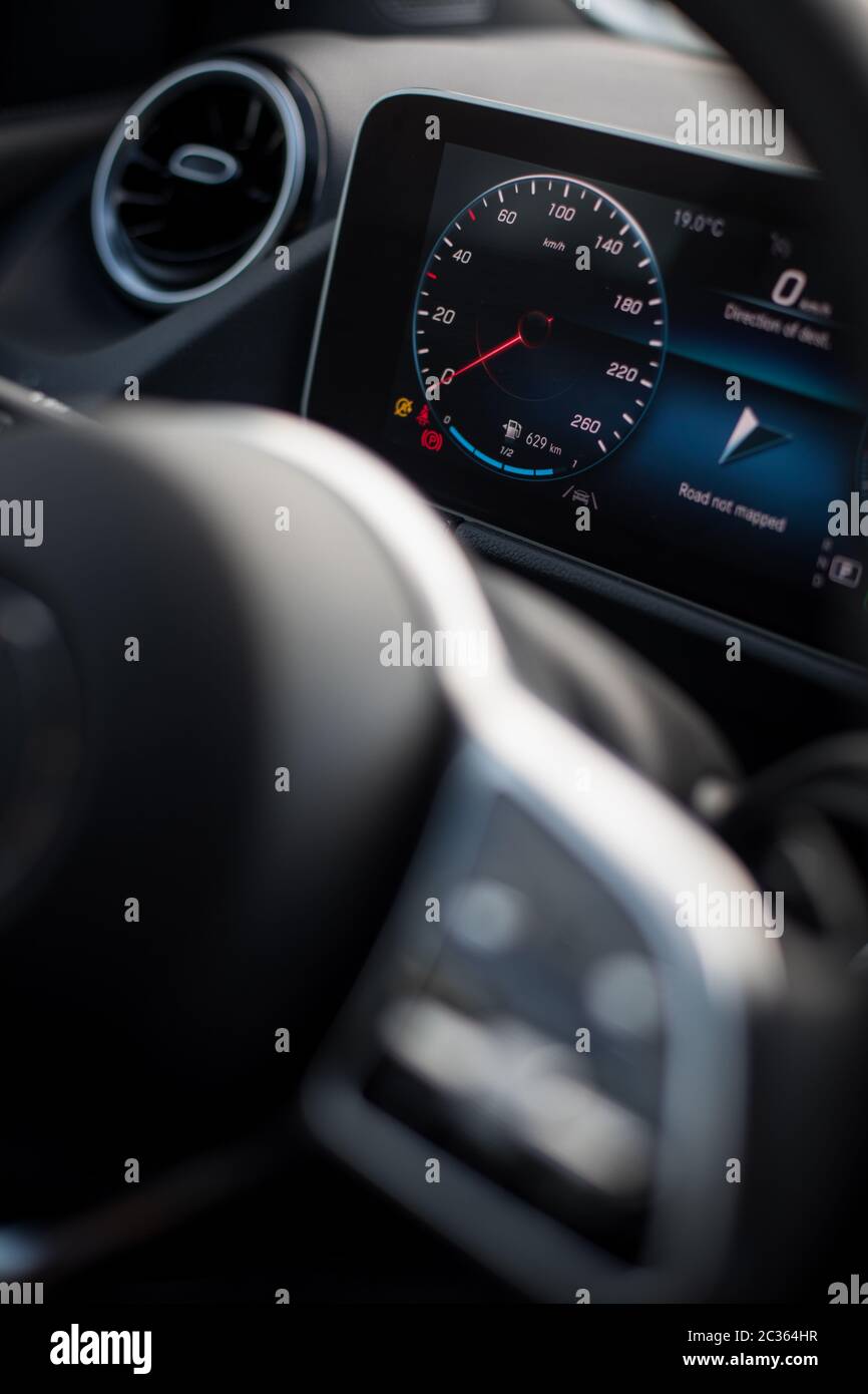 Close up shot with the digital speedometer on a modern car dashboard ...