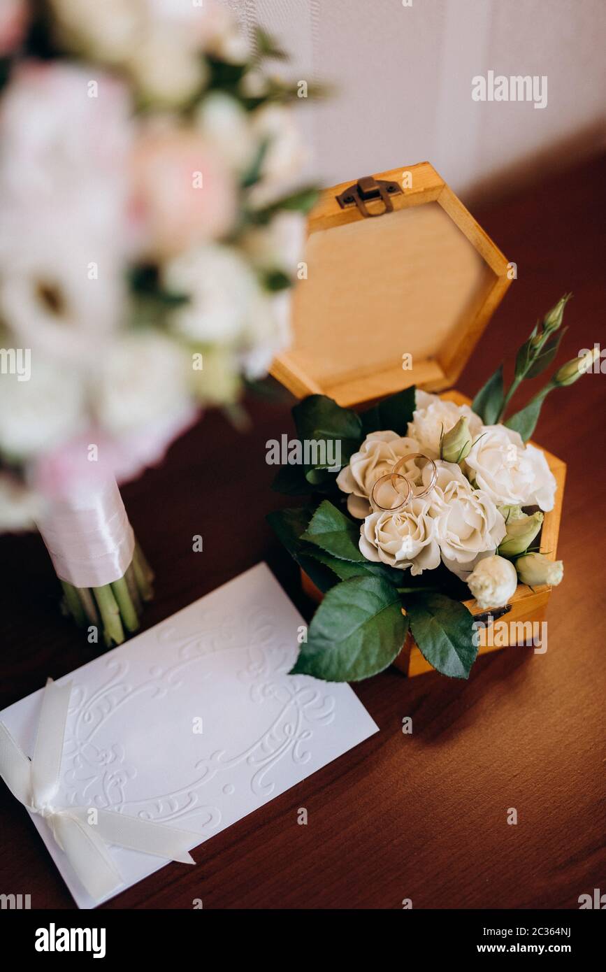 wedding rings with a wedding decor Stock Photo - Alamy