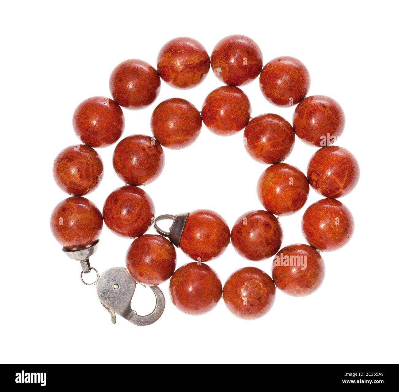 top view of spiral necklace from polished red coral balls isolated on ...