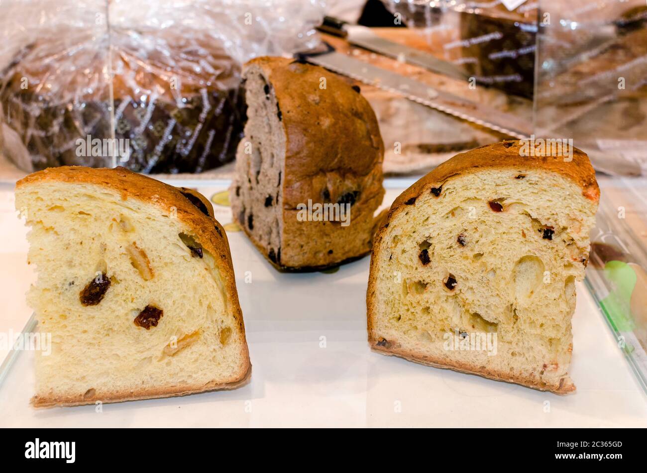 Three differente variety of italian traditional panettone in a display ...