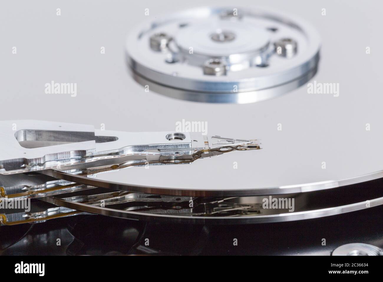 Open hard drive with magnetic disk and writing head Stock Photo - Alamy