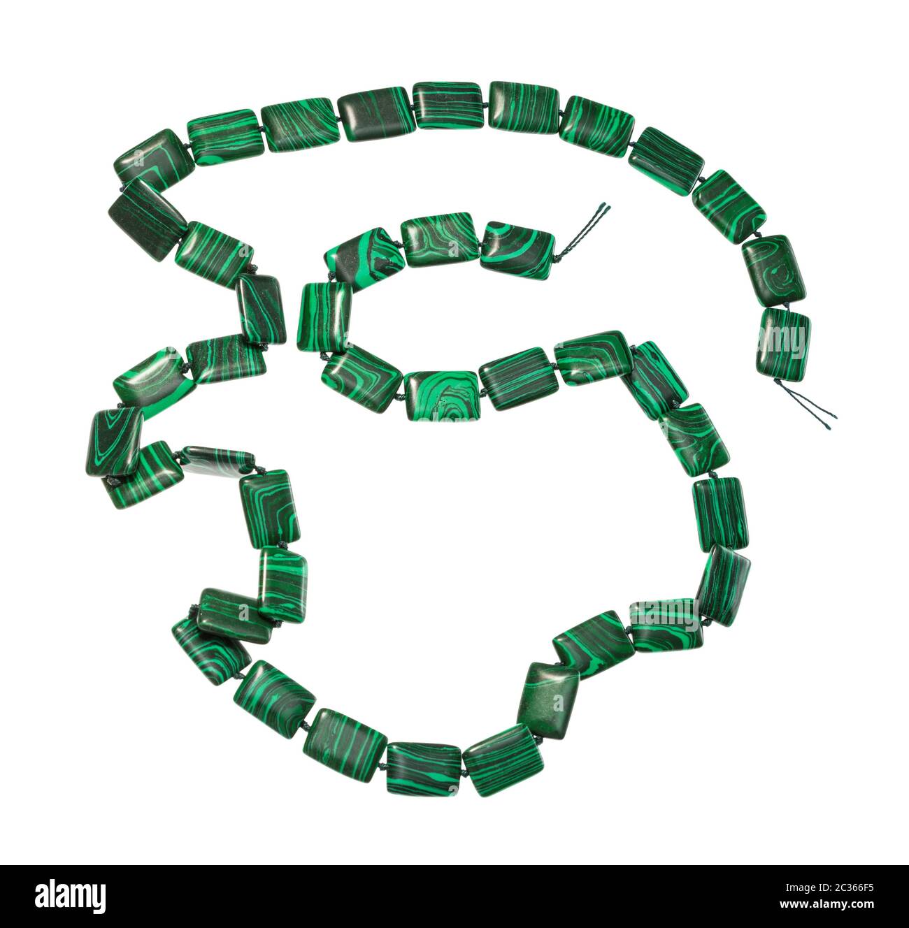 top view of coiled string of beads from artificial malachite isolated ...
