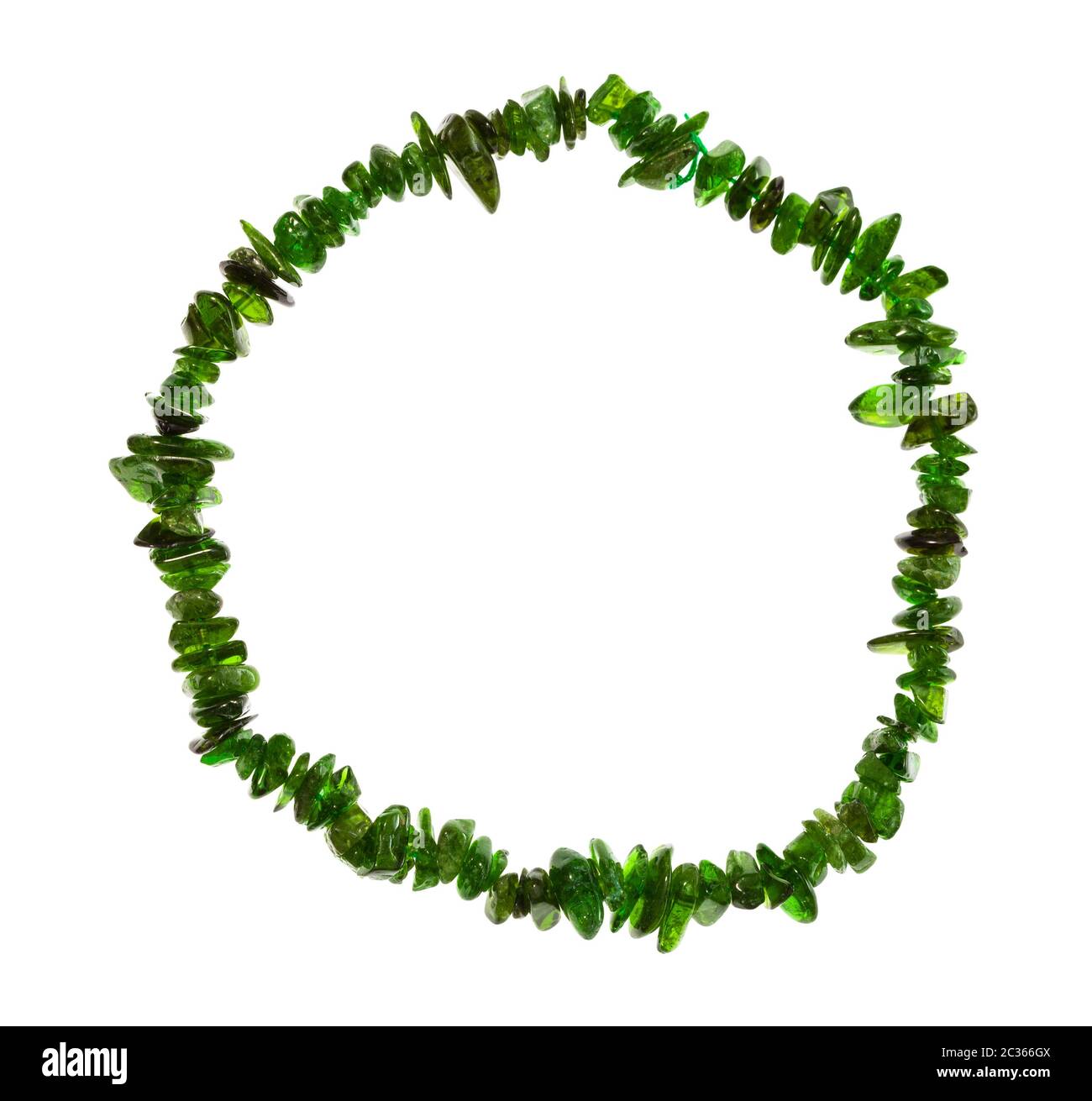 top view of string of beads from natural tumbled chrome diopside gemstone isolated on white ...
