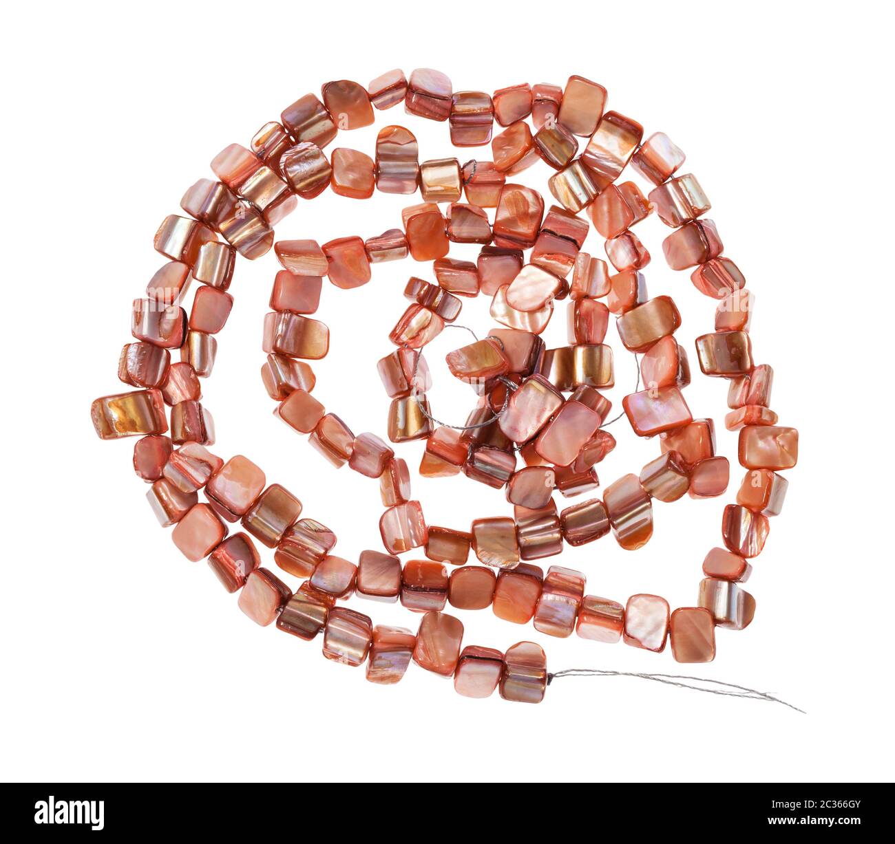 top view of tangled string of beads from natural pink pieces of mother ...