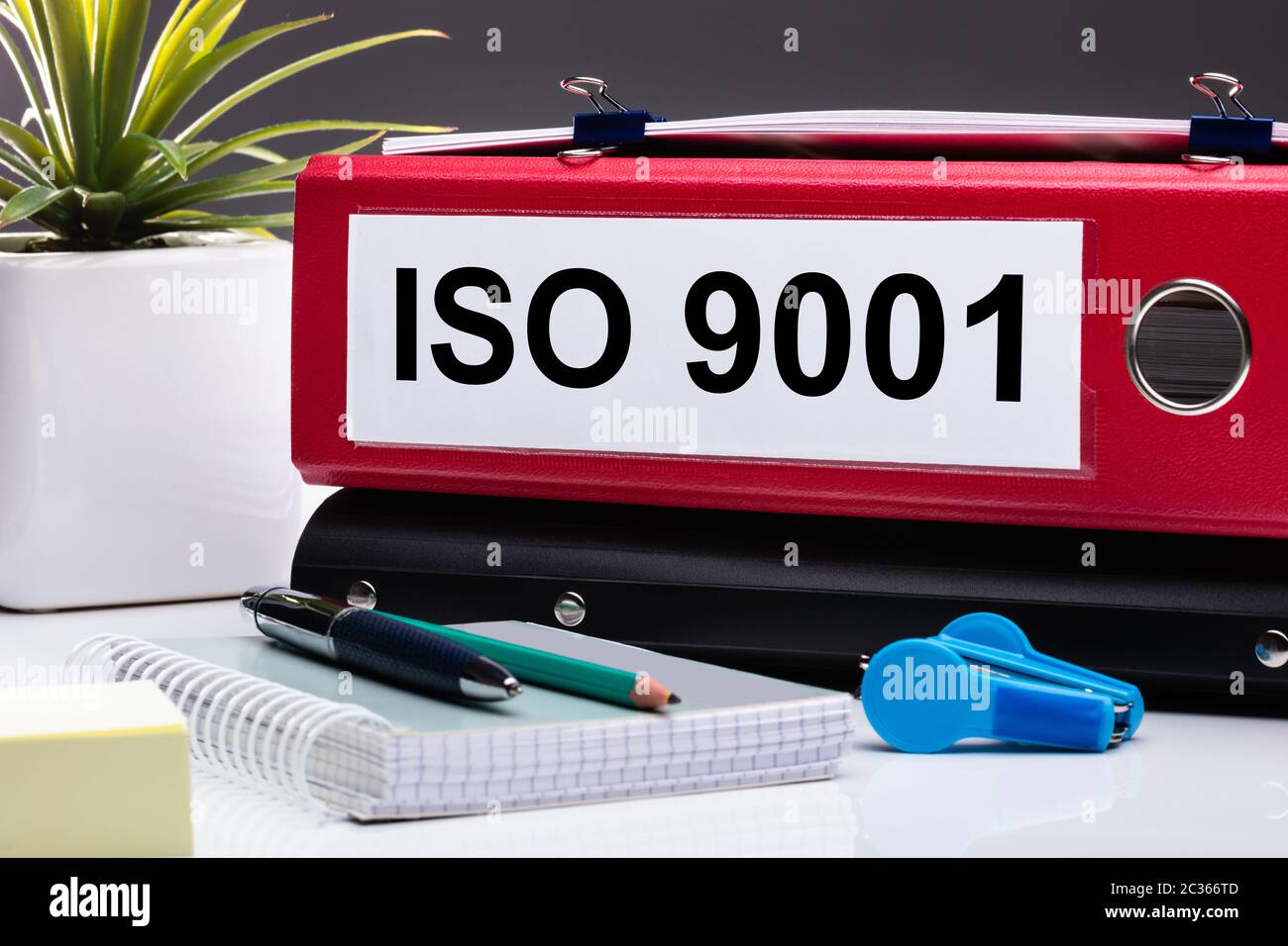 Close-up Of An Office Desk With Iso 9001 Folder And Other Office ...