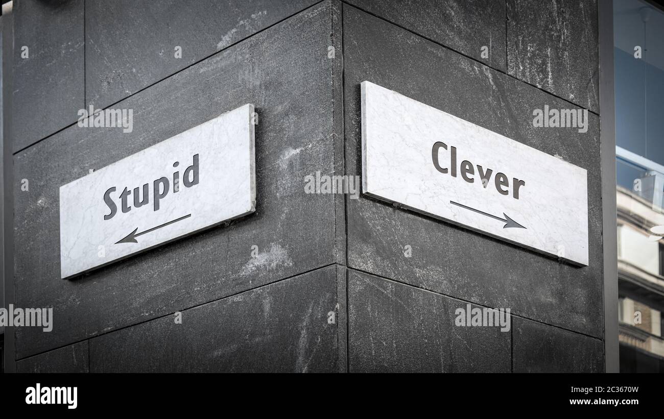 Street Sign Clever versus Stupid Stock Photo - Alamy