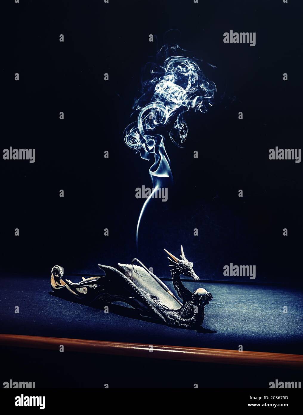 smoke incense stick, smoke on a black background Stock Photo - Alamy