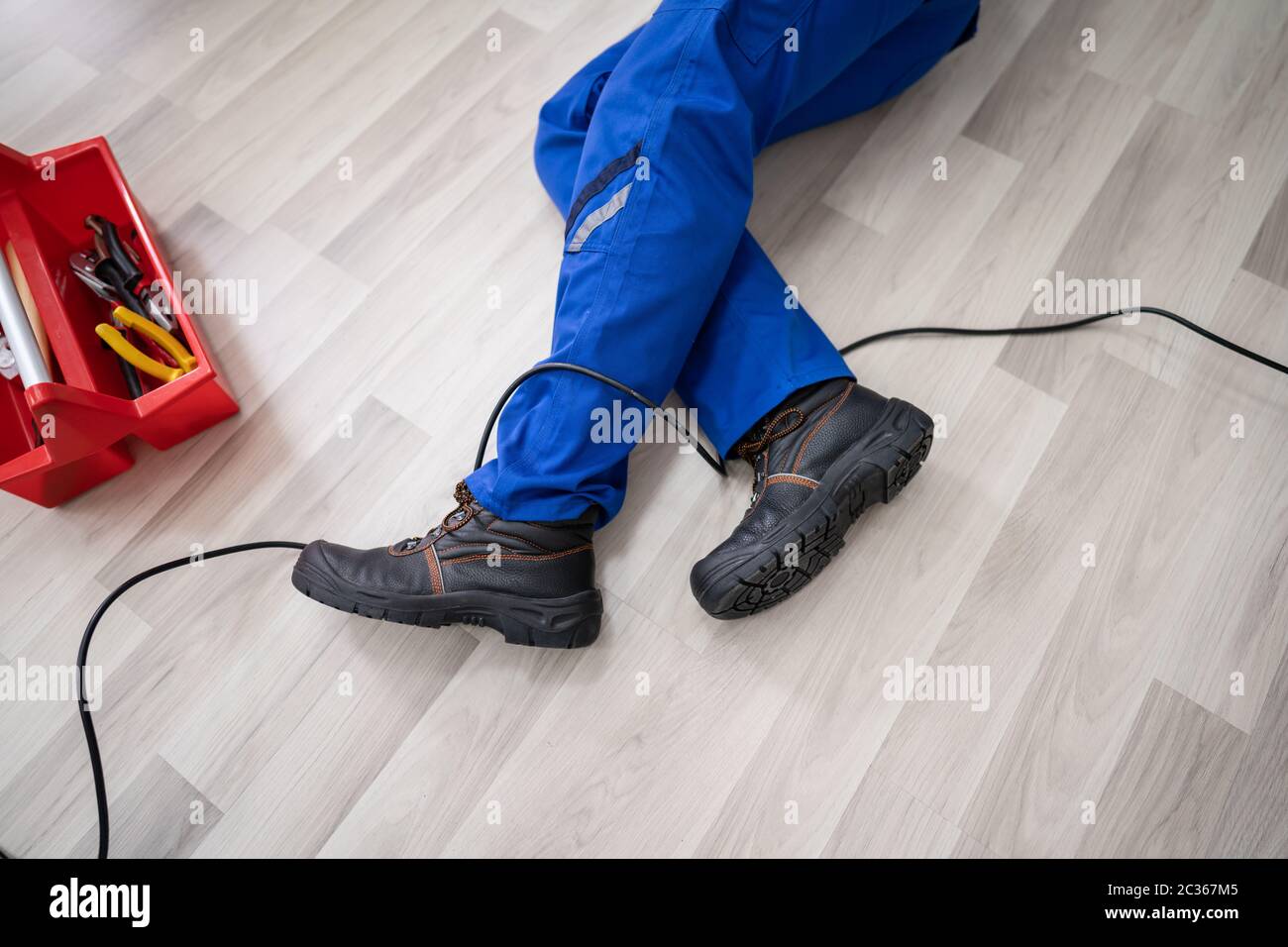 Low Section Of Male Electrician Wrapped In Wire Fallen On Floor Stock ...
