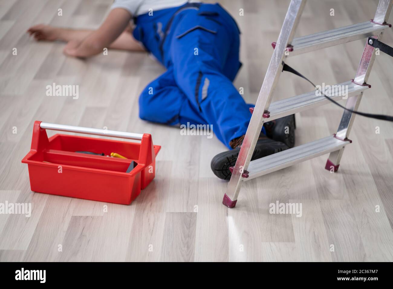 Unconscious Handyman Fallen From Ladder With Equipment Lying On Floor ...
