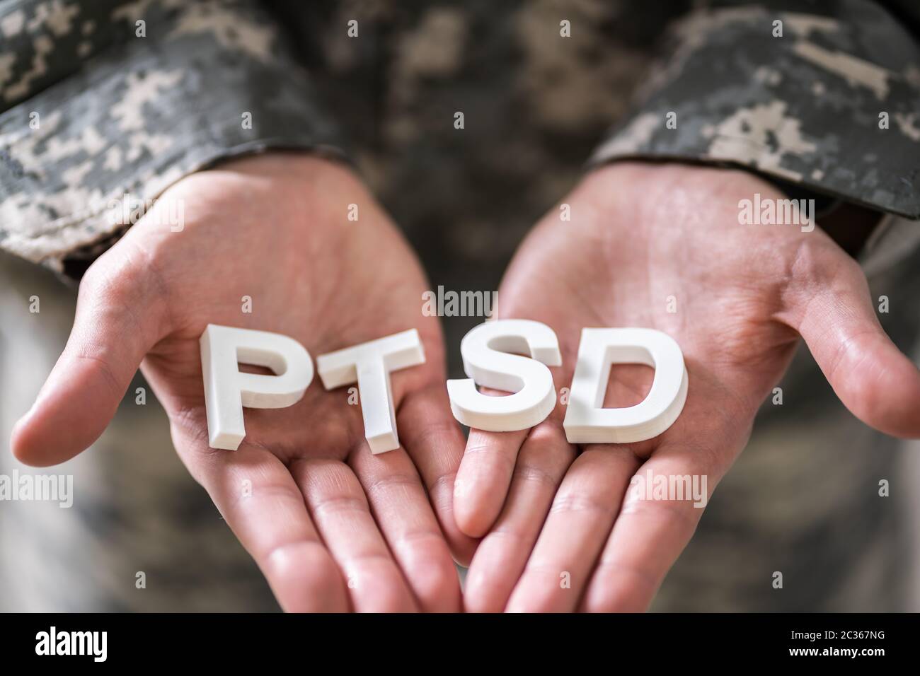 Close-up Of Male Soldier In Military Uniform Holding Wooden Cubes With ...