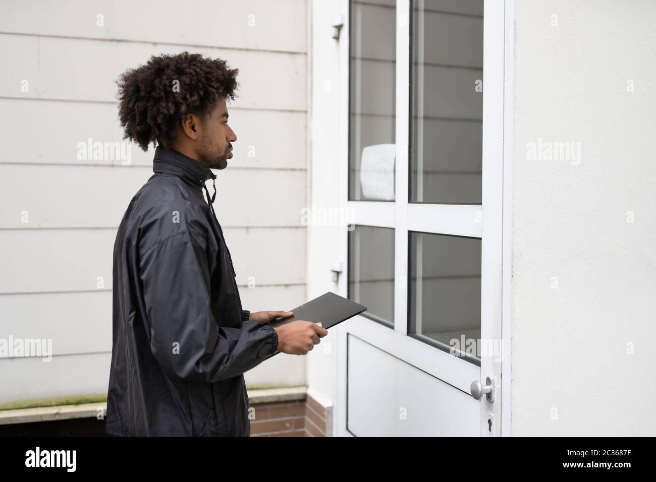 Person Standing In Front Of An Open Door